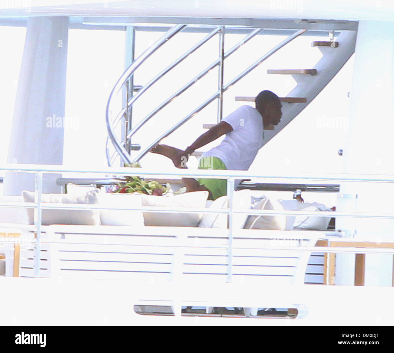 Jay-Z does his exercise stretches onboard his superyacht on holiday in ...
