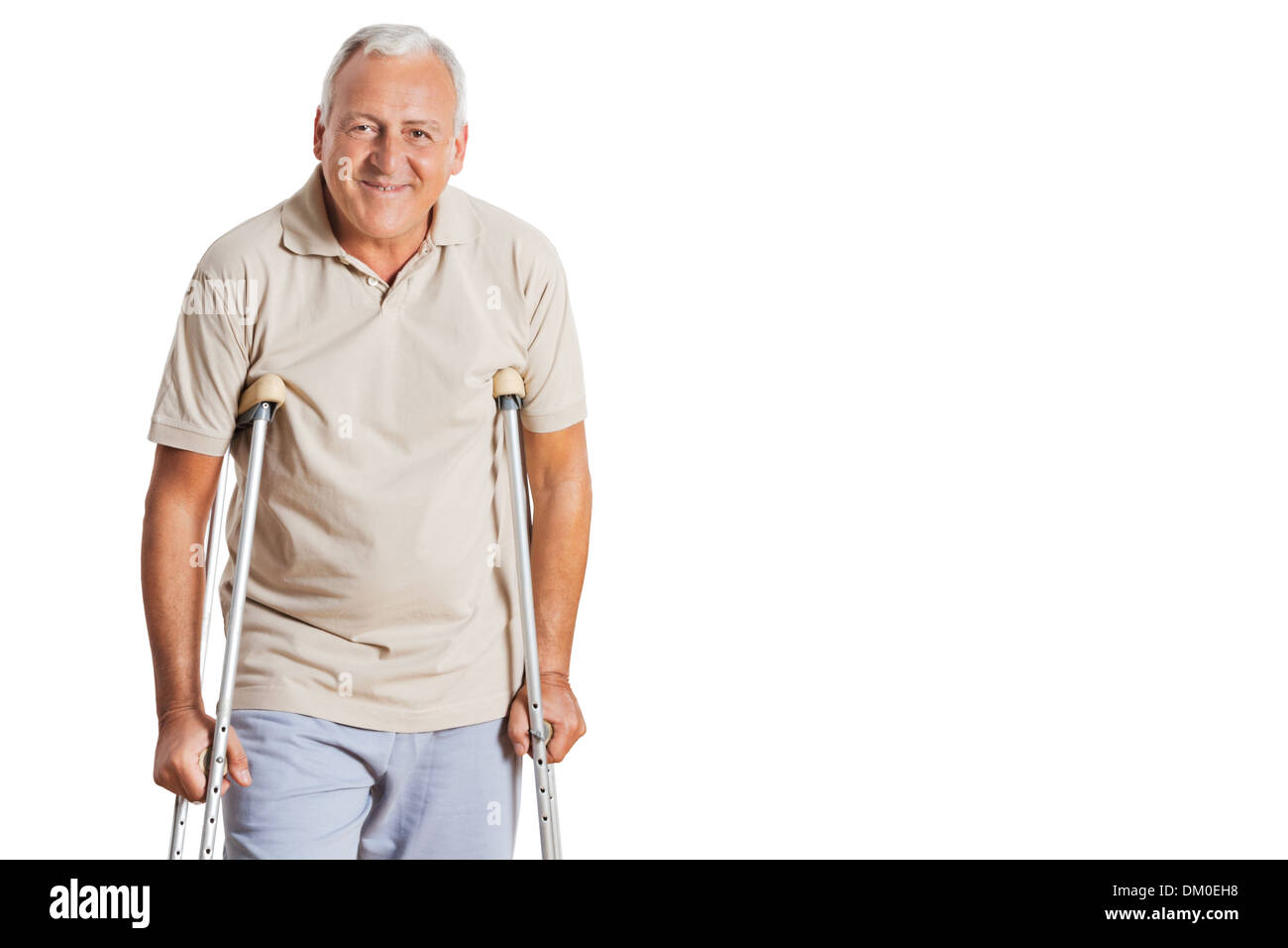 Senior Man On Crutches Stock Photo - Alamy