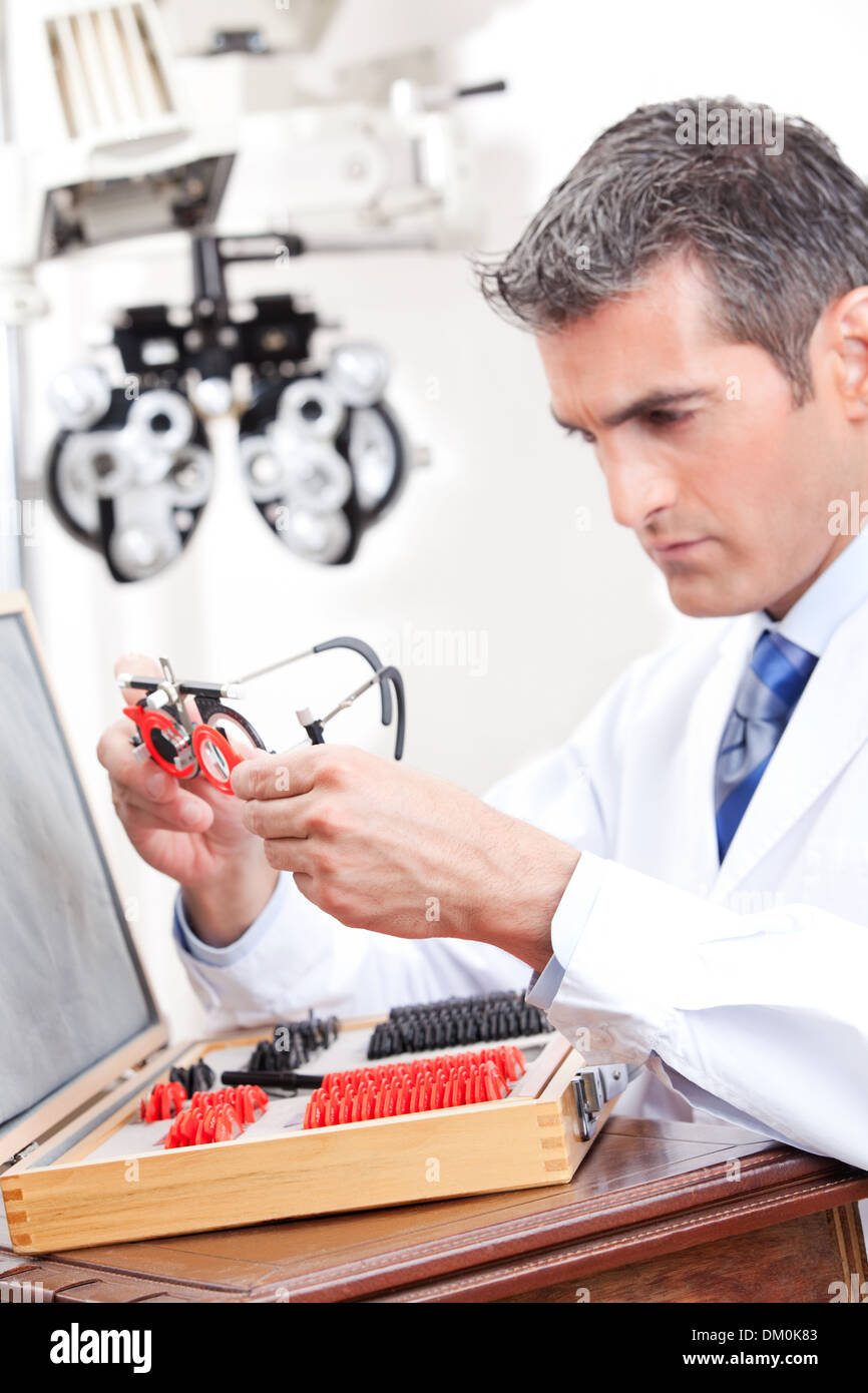 Optometrist Holding Measuring Eye Glasses Stock Photo - Alamy