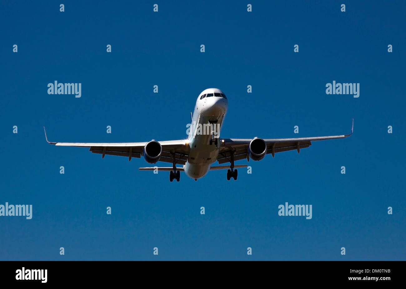 photograph of an airplane few seconds before landing Stock Photo - Alamy
