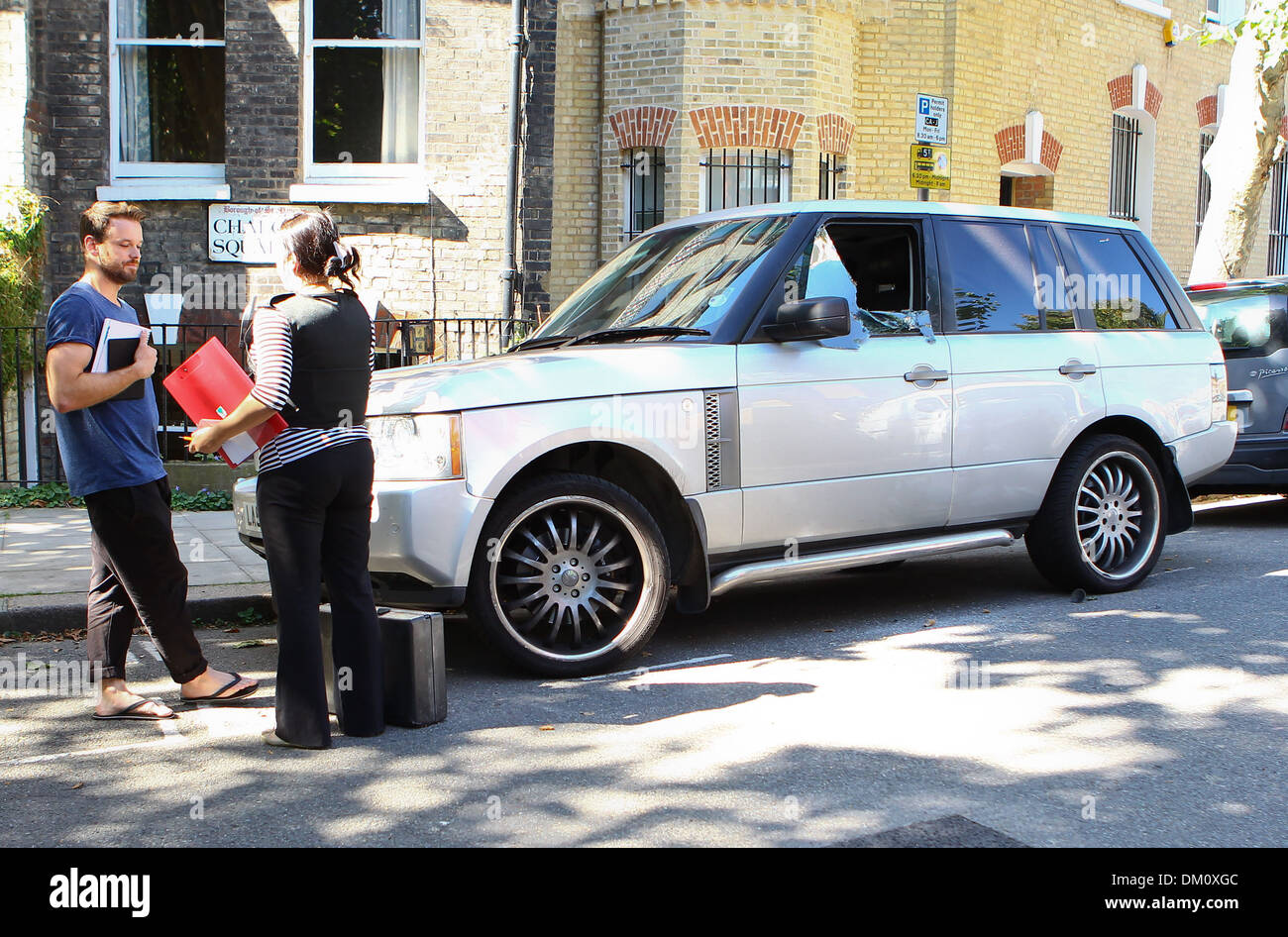 A Scene of Crime Officer checks Sarah Harding's car for finger prints ...