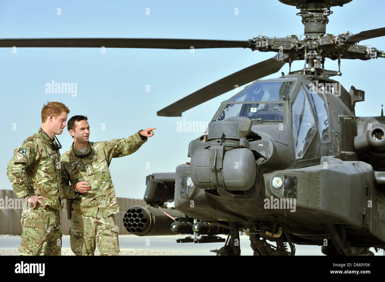 Prince Harry is shown Apache flight-line by a member of his squadron ...
