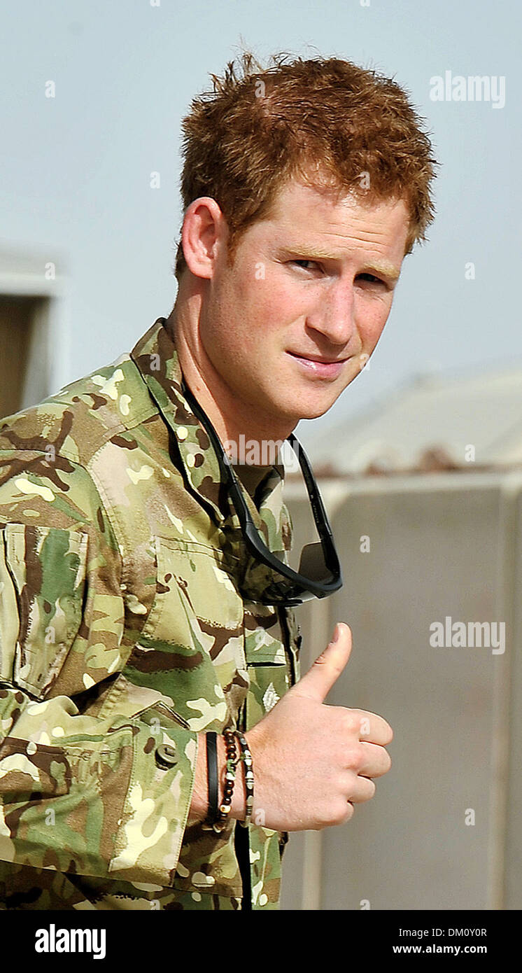 Prince Harry gives a thumbs up after he walked passed Apache flight ...