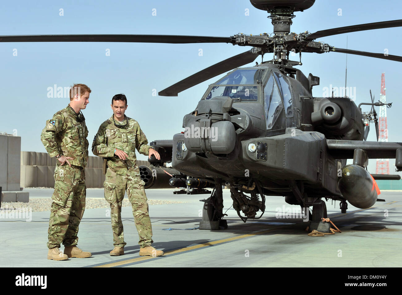 Prince Harry is shown Apache flight-line by a member of his squadron ...