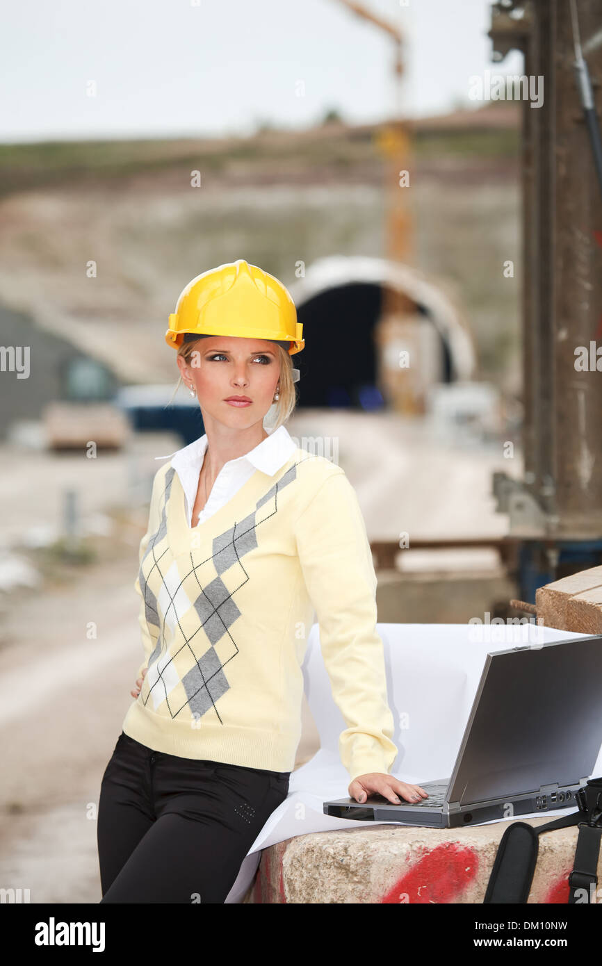 A young female constructor at building of a new motorway in Germany ...