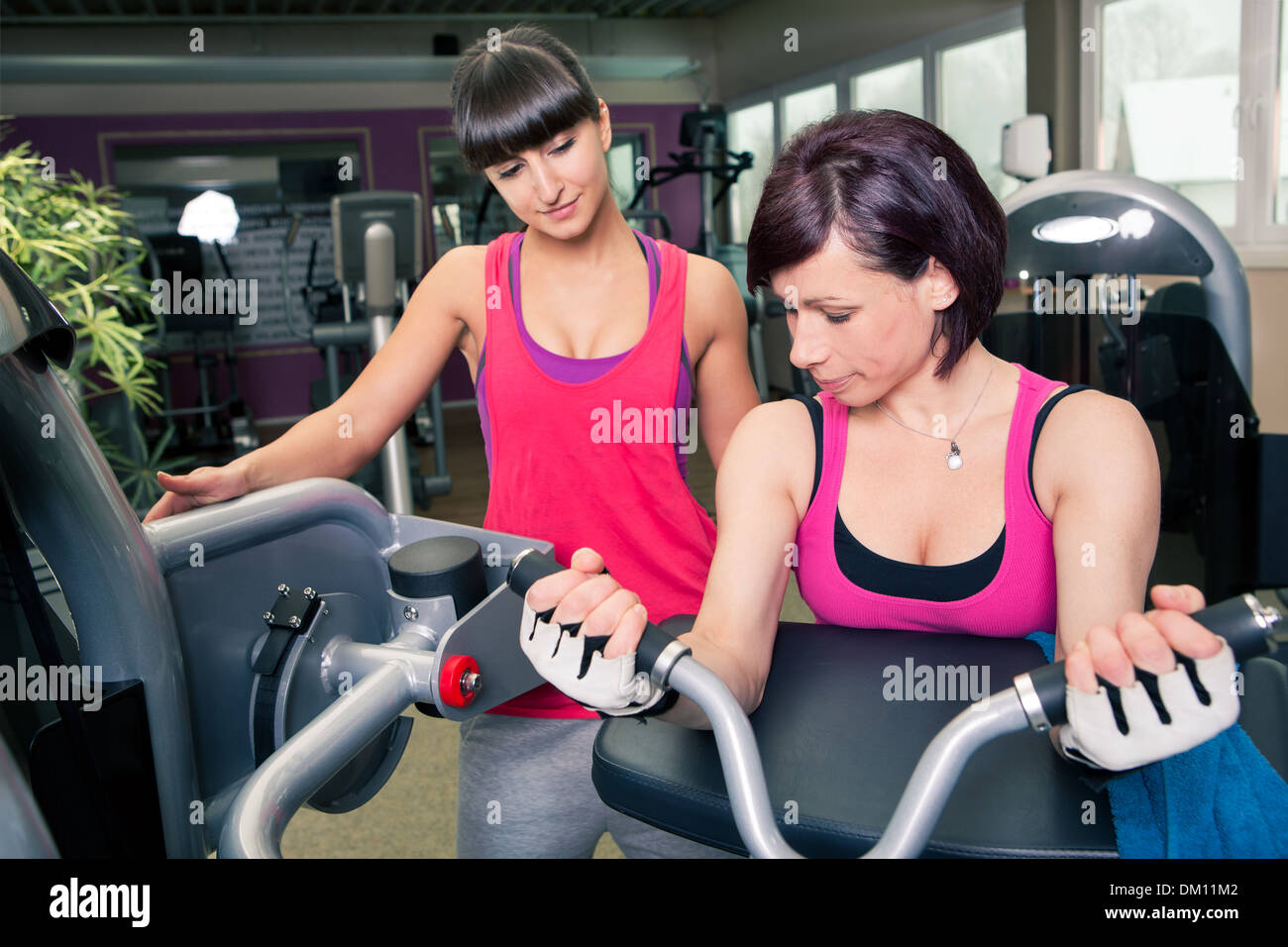 young woman in sport dress in a gym room Stock Photo - Alamy