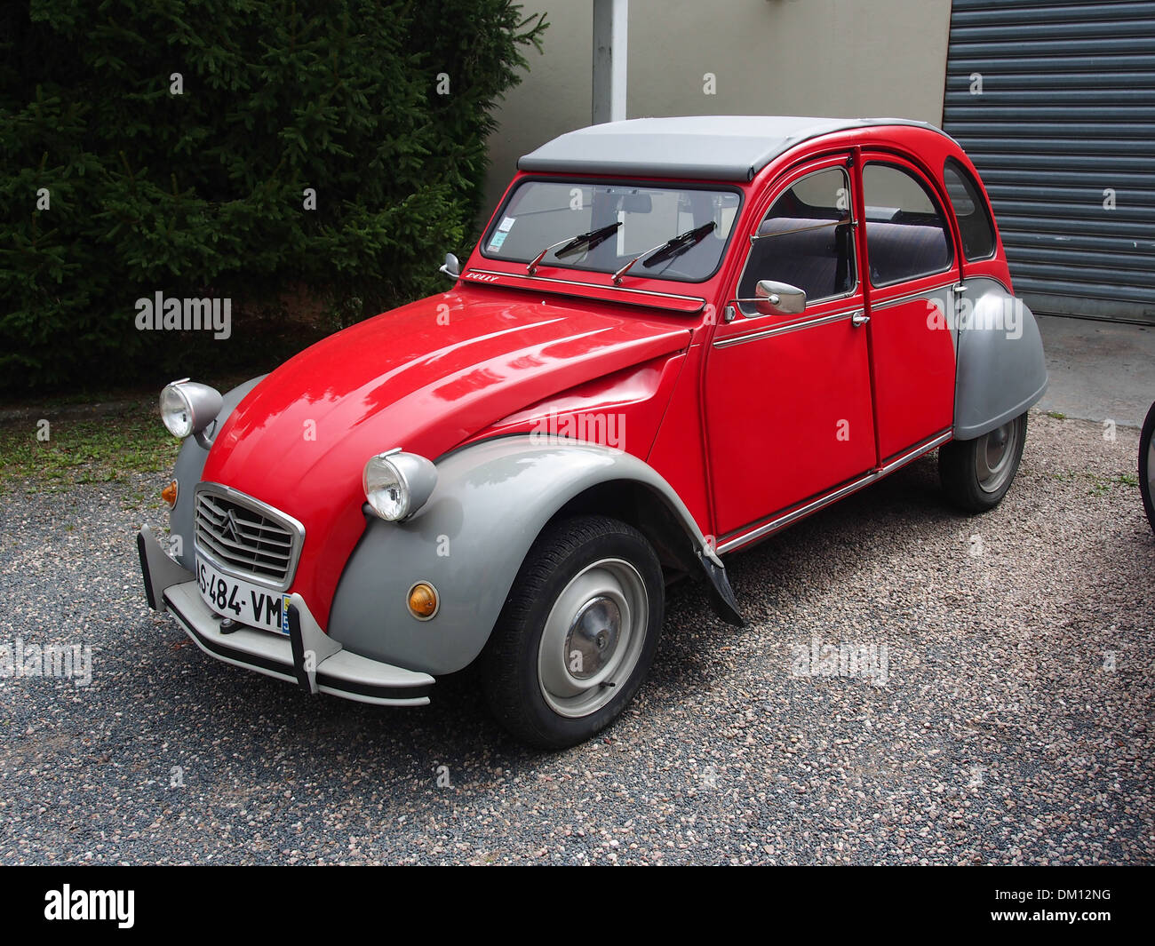The Citroën 2CV, with its distinctive red-grey color scheme, is a ...