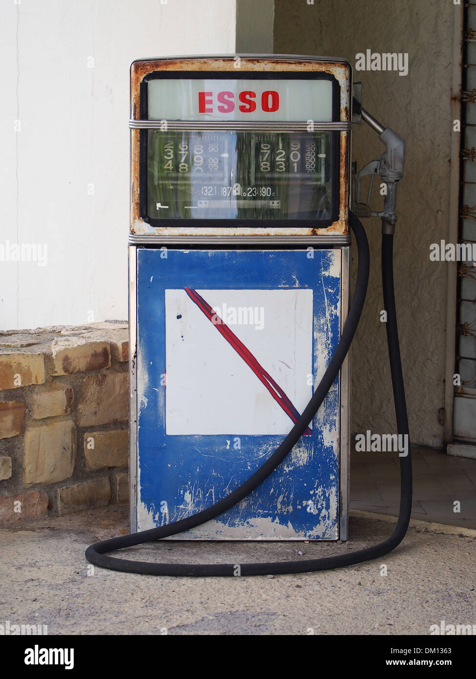 A vintage Esso petrol pump, showcasing early fuel station technology ...