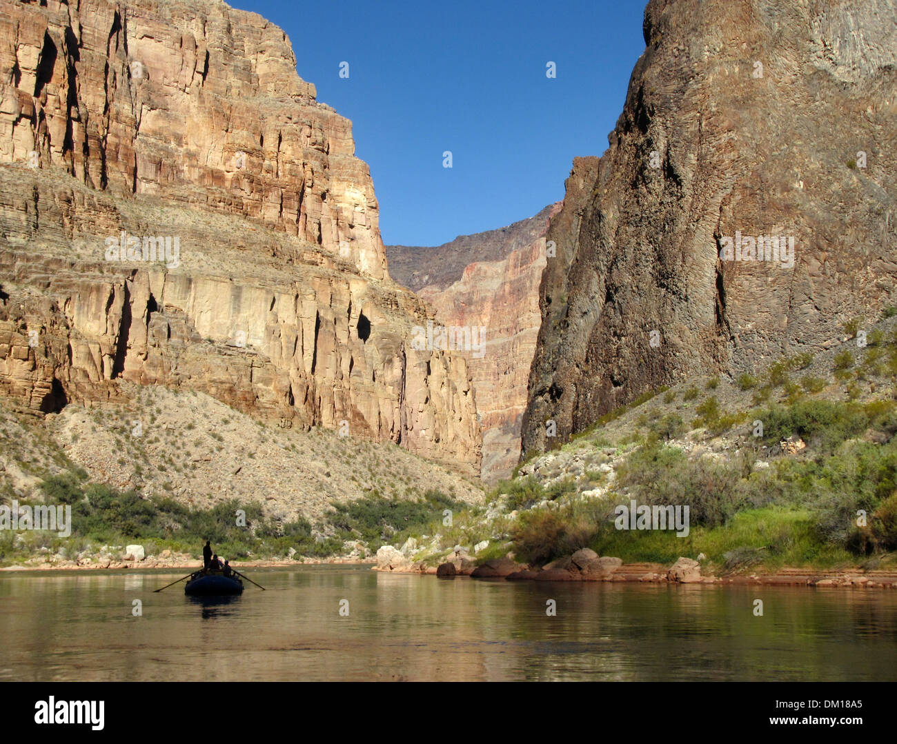 A single silhouetted raft drifting in the Grand Canyon Stock Photo - Alamy