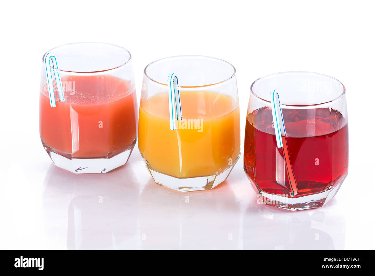 juice of different colors on a white background Stock Photo - Alamy