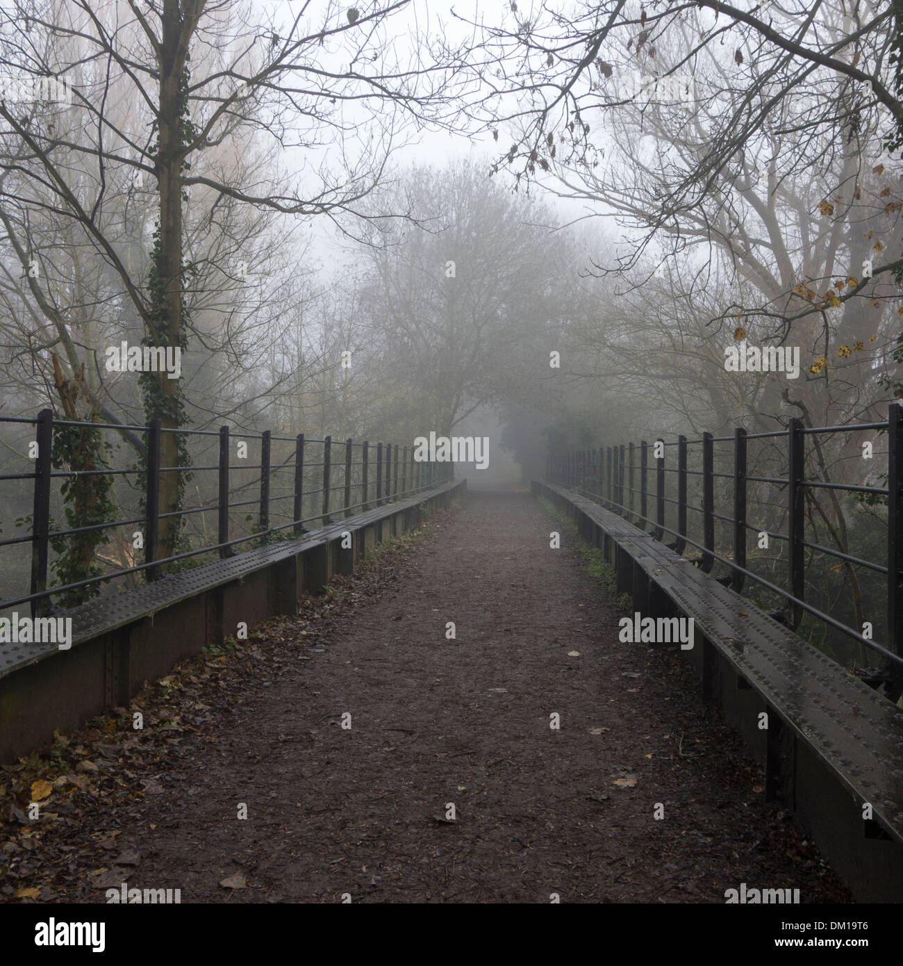 Going nowhere: a footpath leading into mist Stock Photo - Alamy