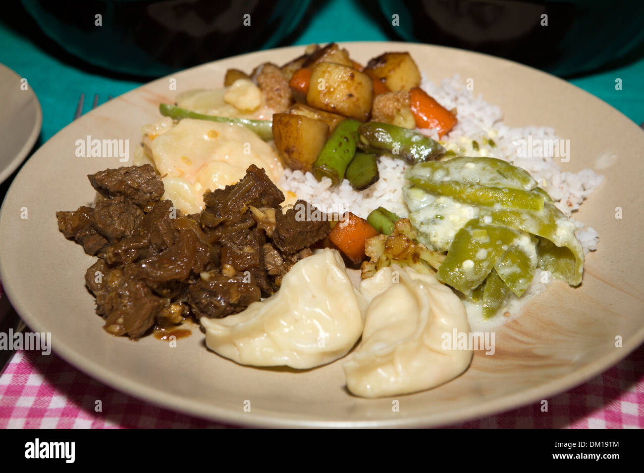 Bhutan, Bhutanese food, plate of ema datse, steamed momos, pork and ...