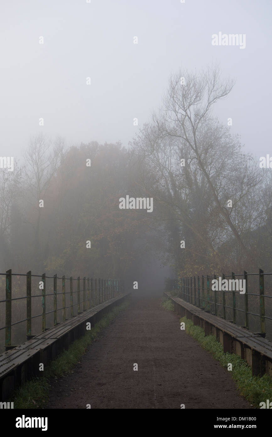 Going nowhere: a footpath leading into mist Stock Photo - Alamy