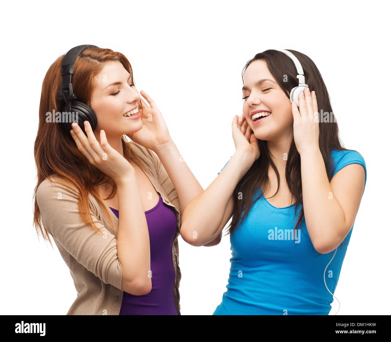 two smiling teenagers with headphones Stock Photo - Alamy