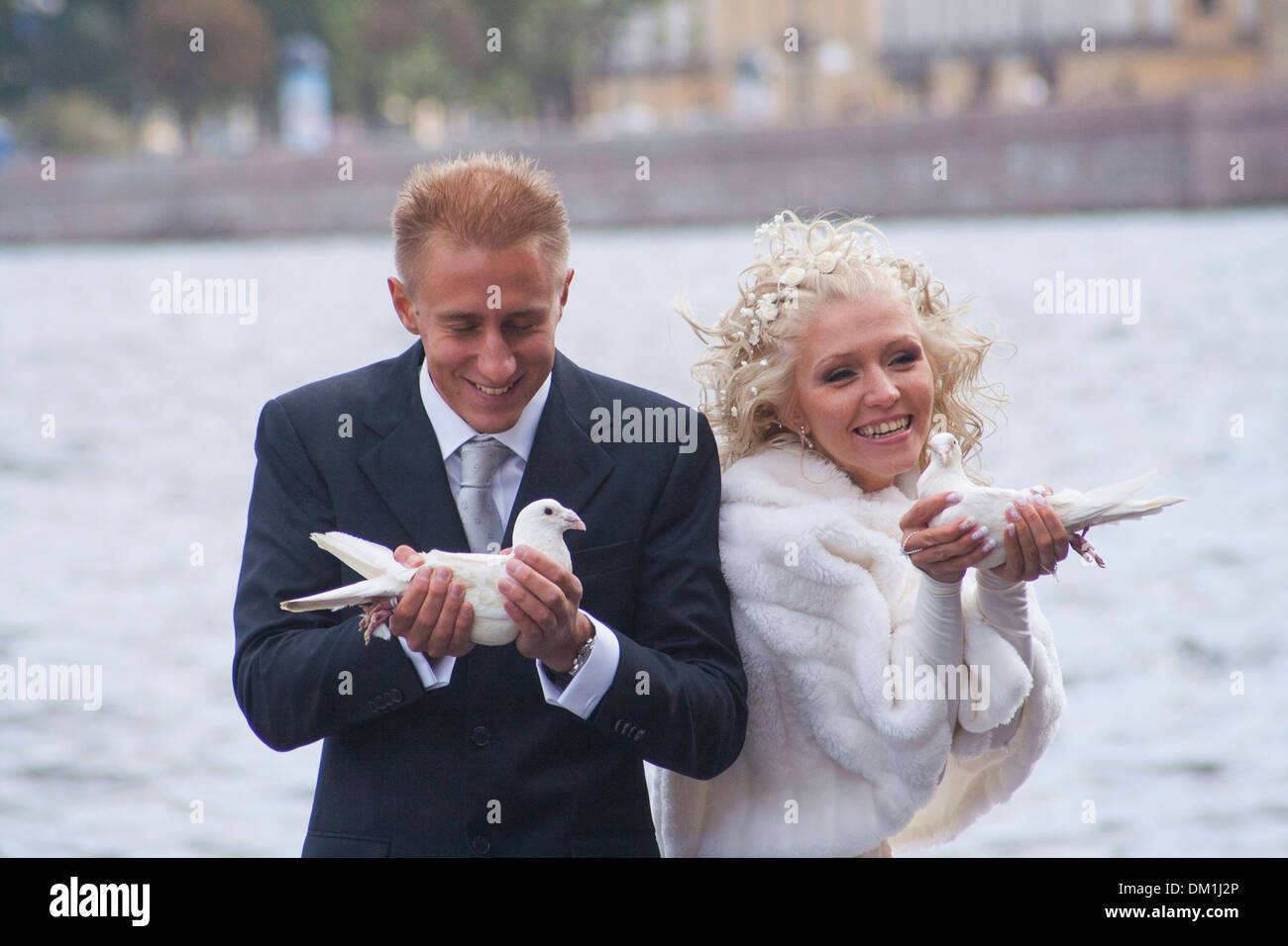 Russia, St Petersburg, newly weds about to release white doves at the ...