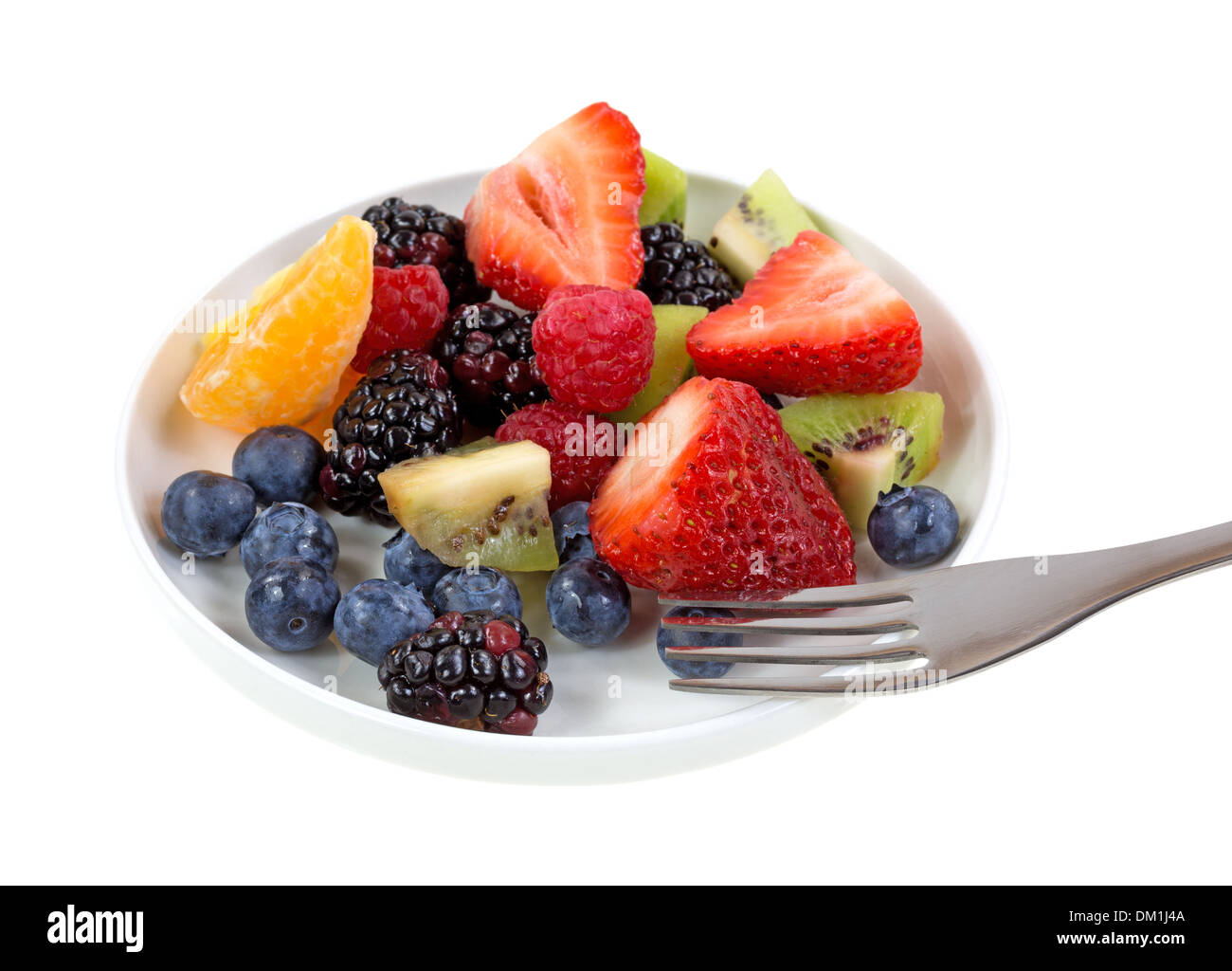 A small dish with several types of fruit both whole and cut with a fork ...