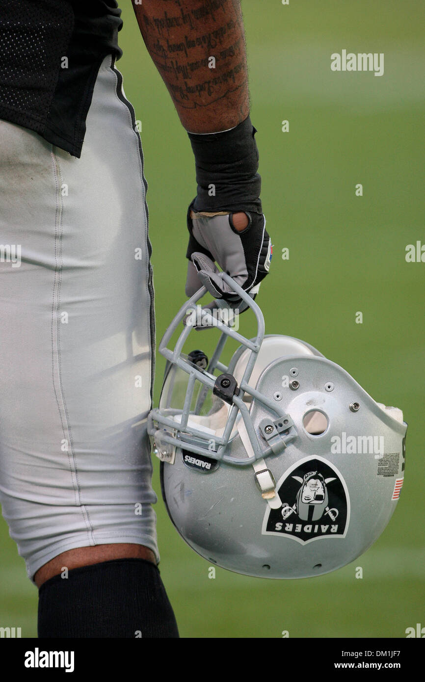 Oakland Raiders Mario Henderson (75) holds his helmet during game ...