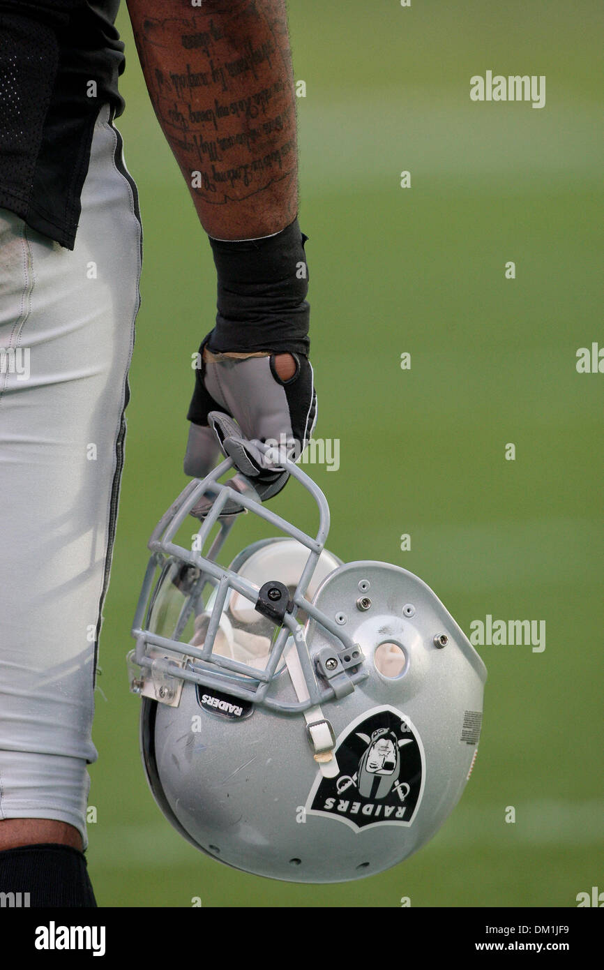 Oakland Raiders Mario Henderson (75) holds his helmet during game ...