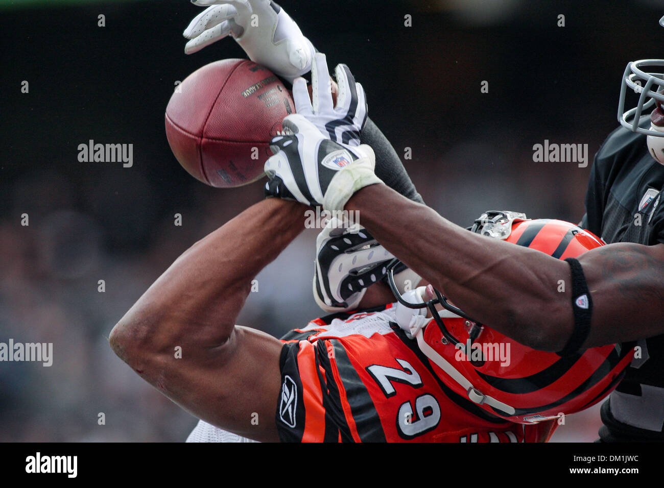 Cincinnati cornerback Leon Hall (29) breaks up a pass in the end zone ...