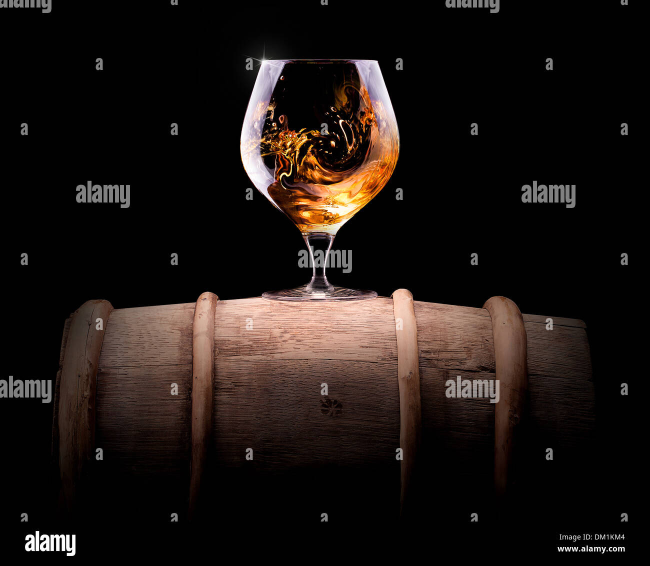 Cognac or brandy on a black background Stock Photo - Alamy