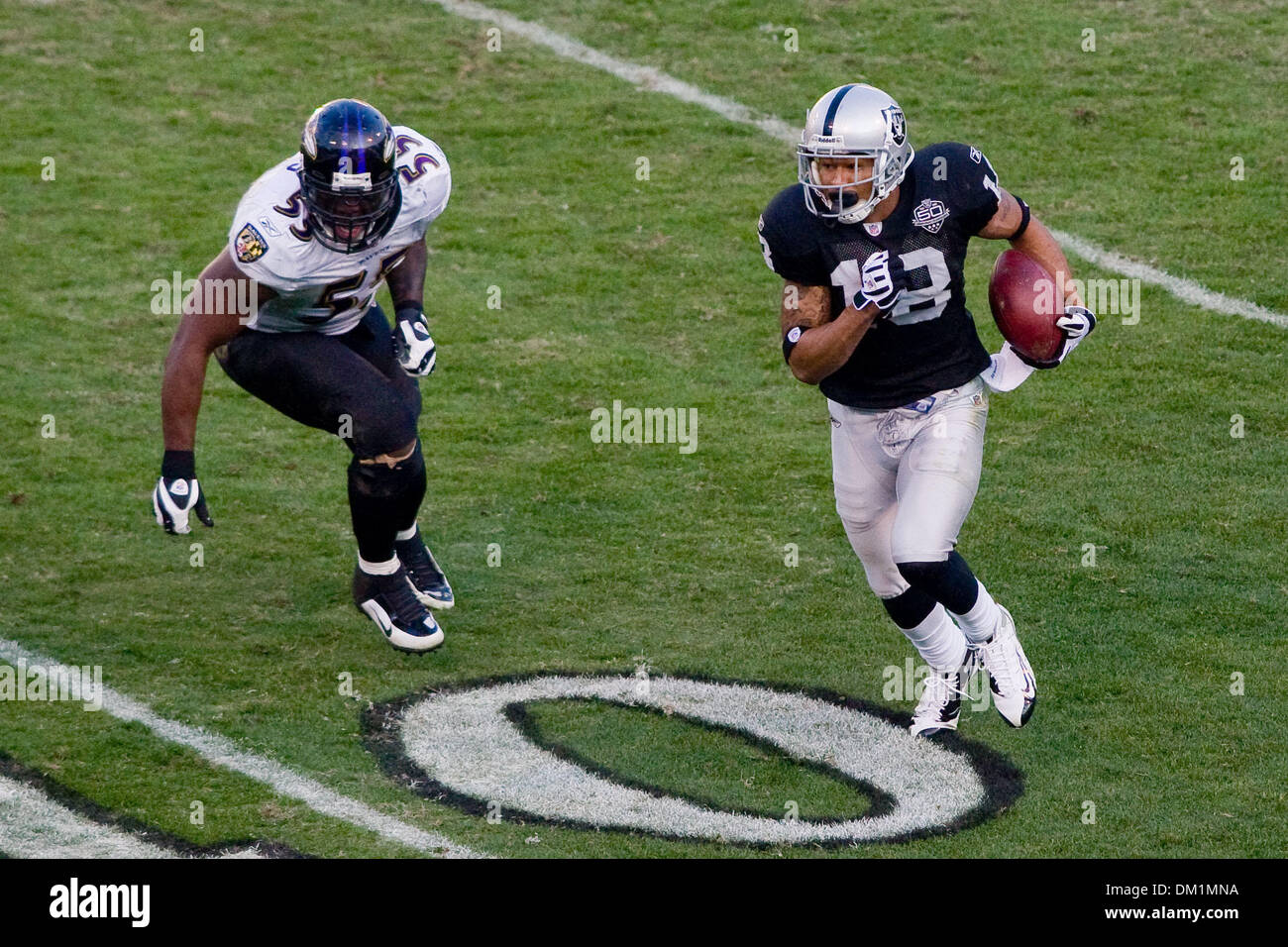 Oakland Raiders' Louis Murphy (18) against Ravens linebacker Dannell ...