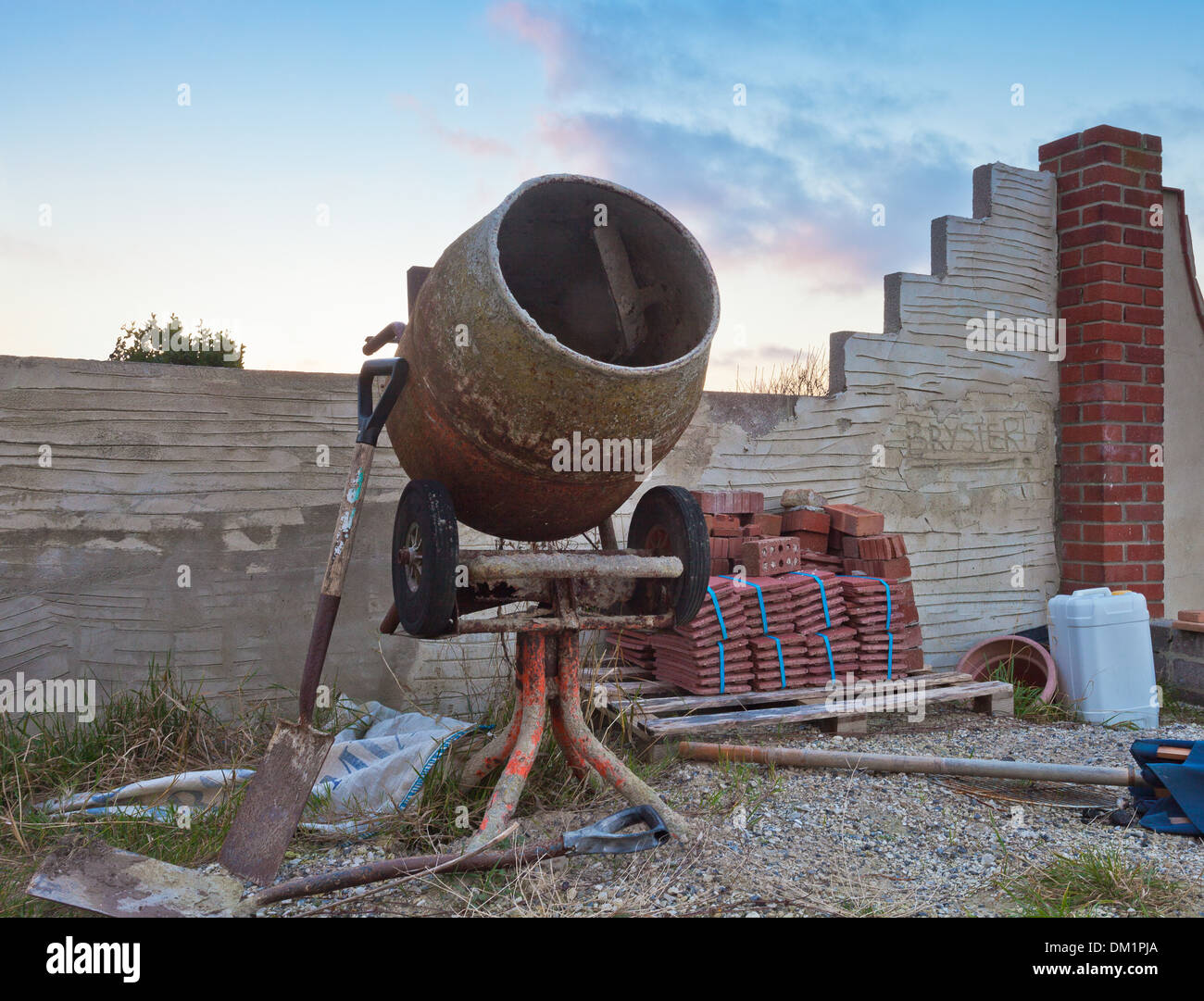cement mixer and building tools/equipment left haphazardly in front of ...