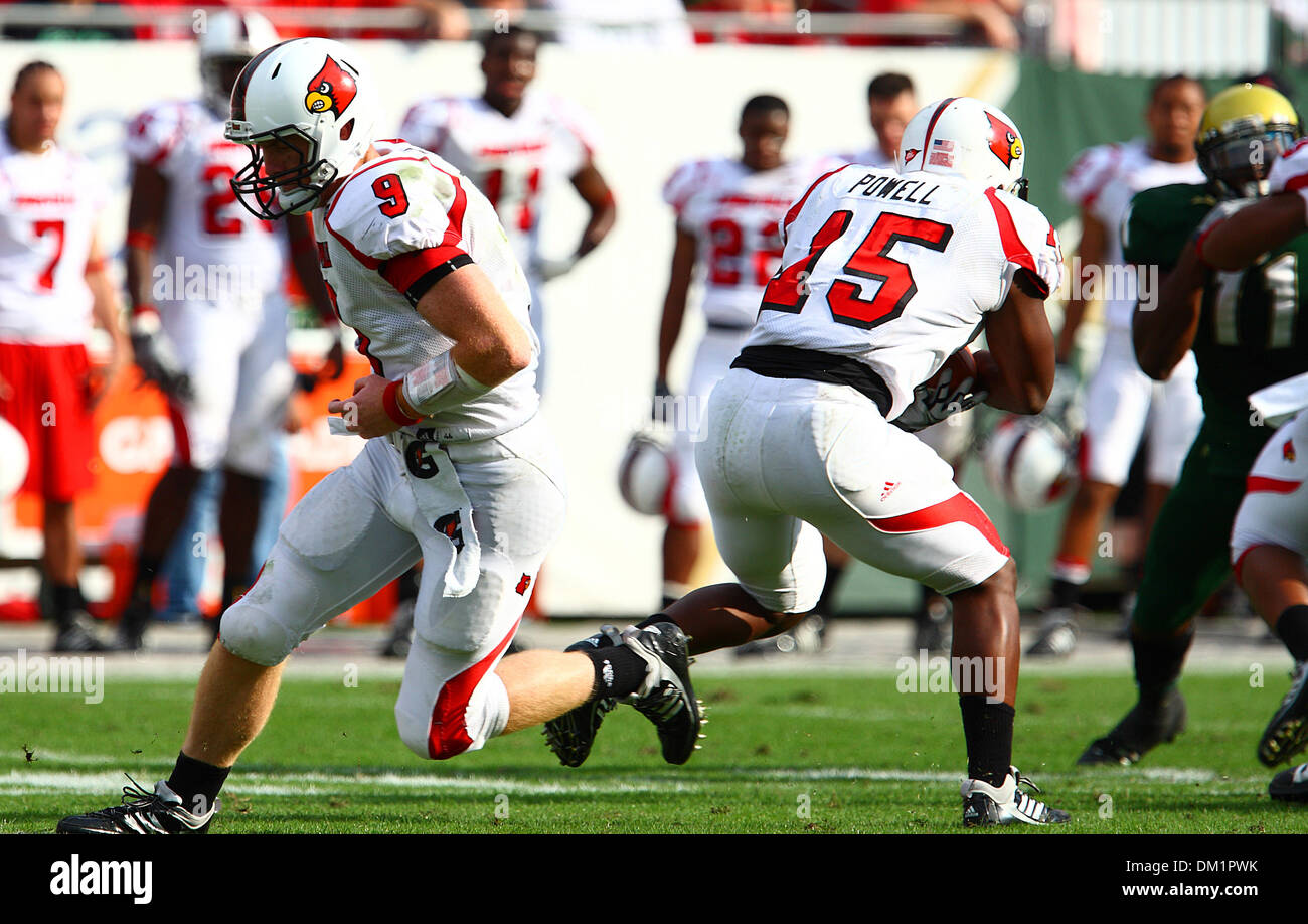 Louisville quarterback Adam Froman #9 hands the ball off to Louisville ...