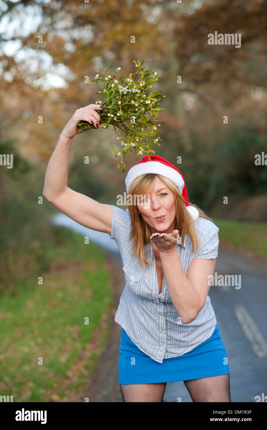 Kissing under the mistletoe hi-res stock photography and images - Alamy