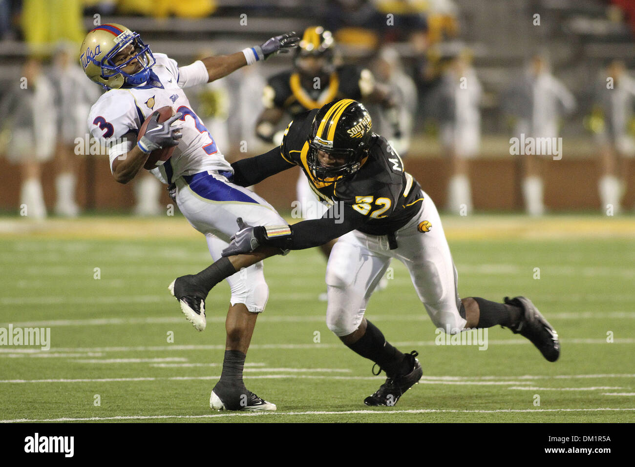 Southern Miss linebacker Martez Smith (32) puts a big hit on Tulsa wide ...