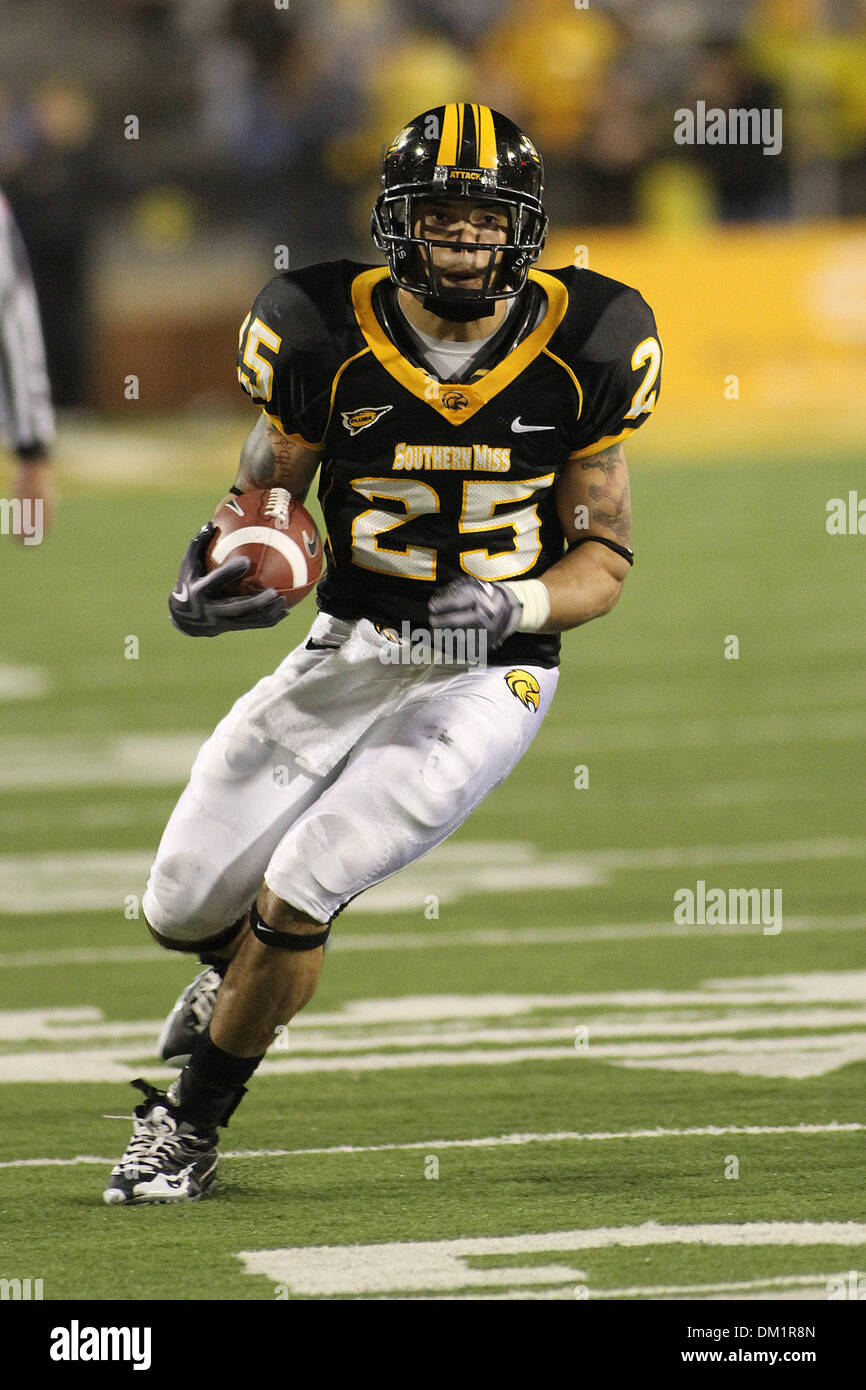 Southern Miss running back Damion Fletcher (25) tries to get to the ...