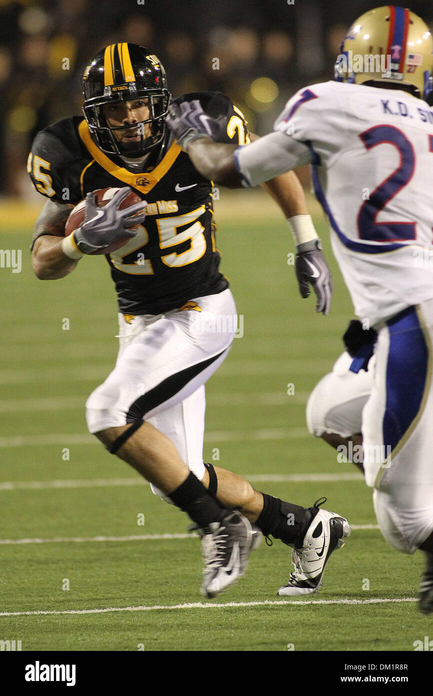 Southern Miss running back Damion Fletcher (25) tries to get to the ...