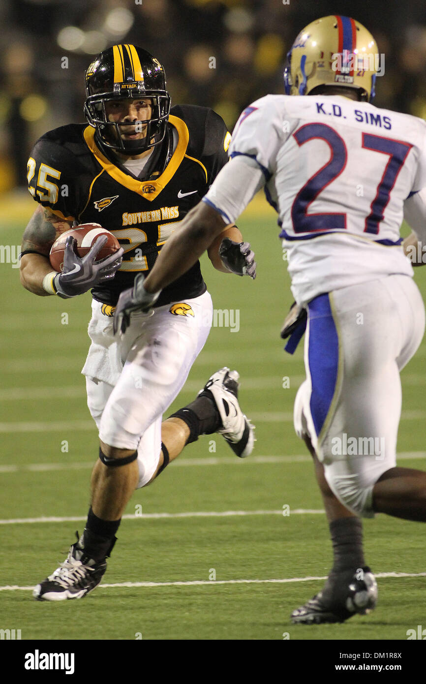 Southern Miss running back Damion Fletcher (25) tries to get to the ...