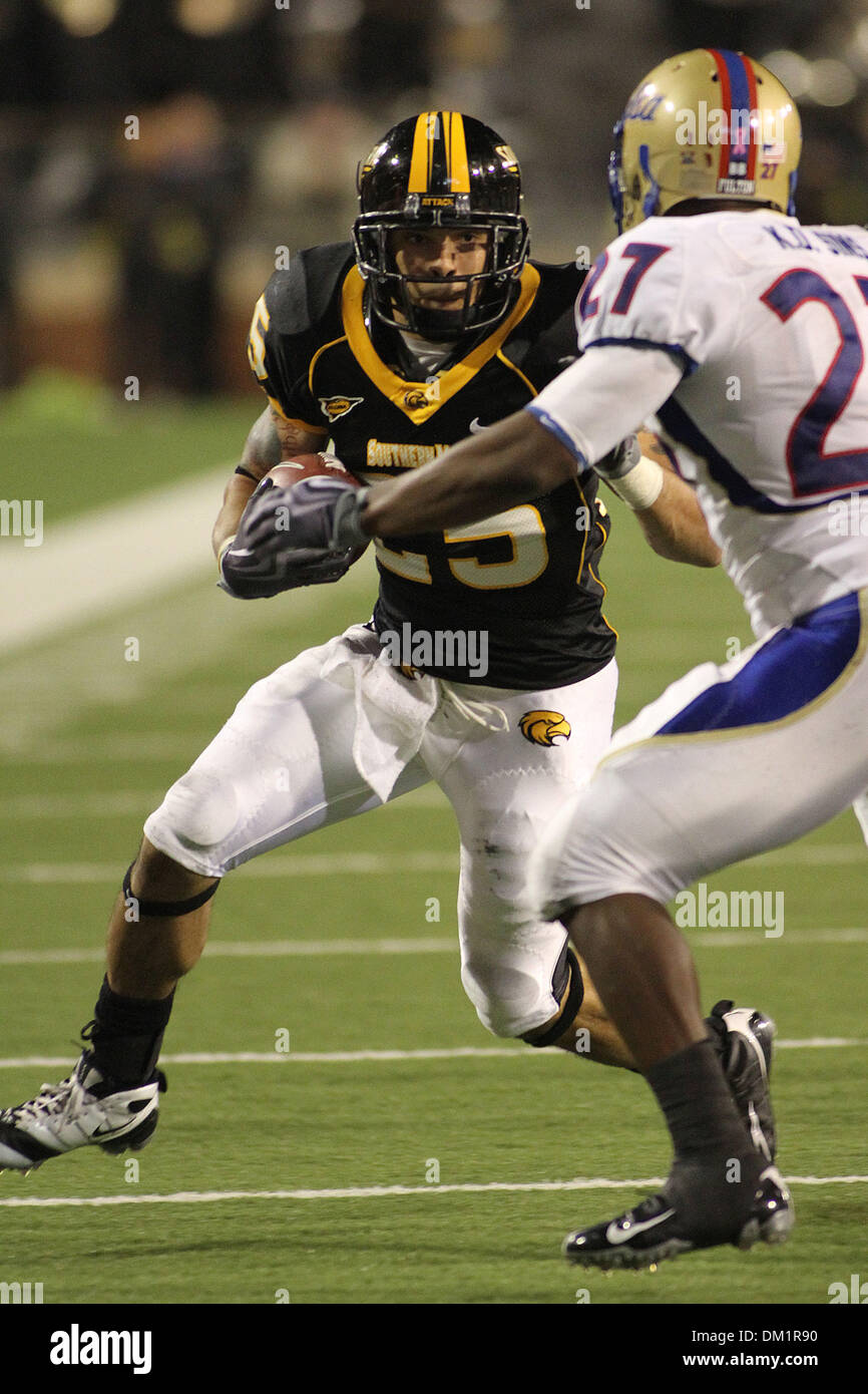 Southern Miss running back Damion Fletcher (25) tries to get to the ...