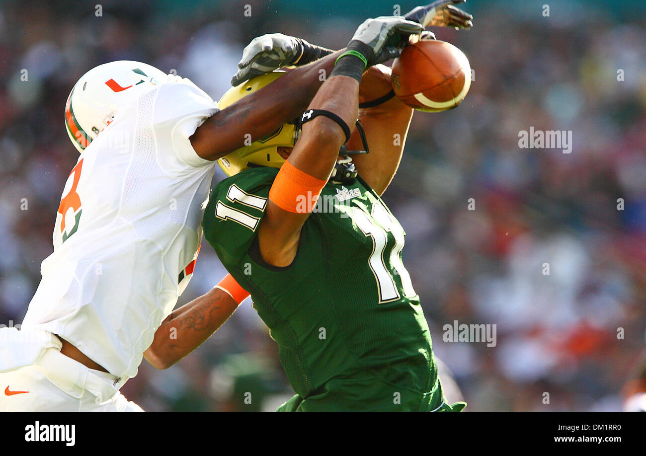 South Florida wide receiver A.J. Love #11 has the ball stripped from ...