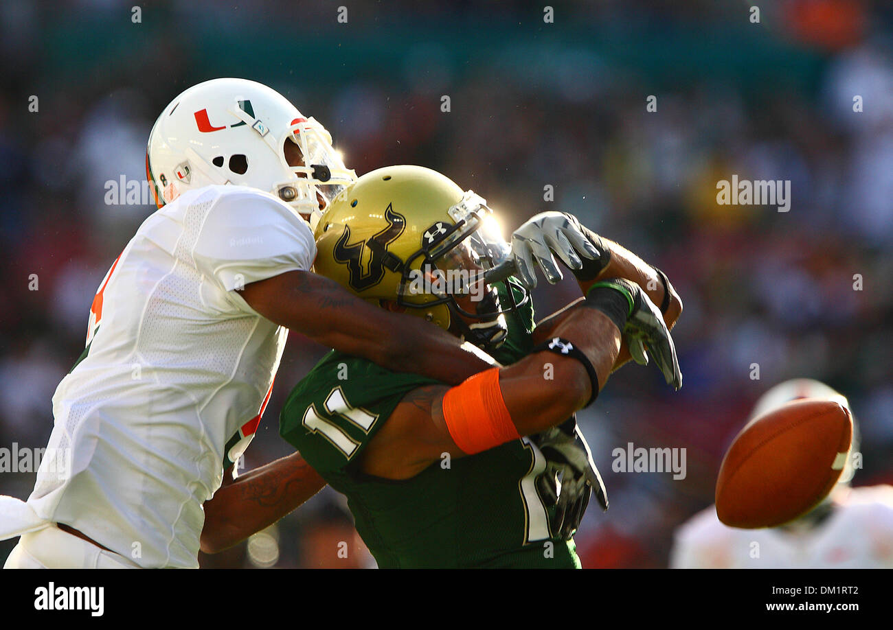 South Florida wide receiver A.J. Love #11 has the ball stripped from ...