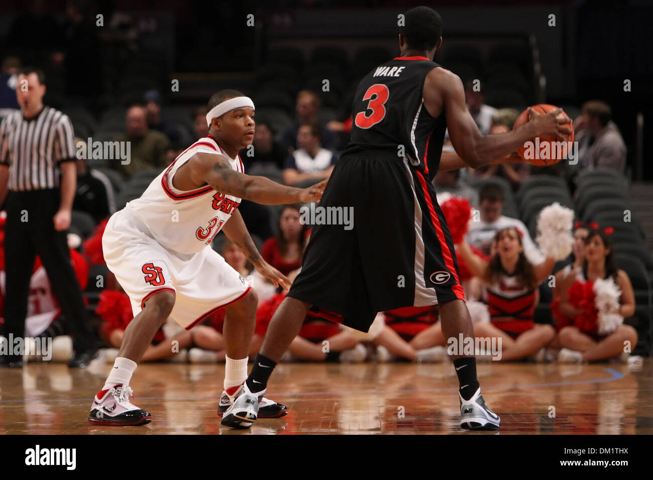 St Johns #31 Malik Stith guarding Georgia's #3 Dustin Ware. St. Johns ...