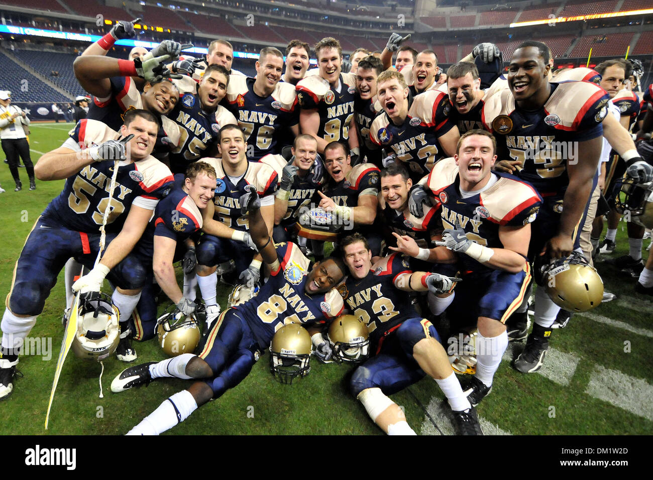 Navy players with the Texas Bowl trophy after the NCAA football game ...