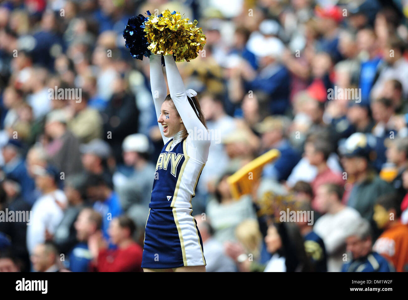 A Navy cheerleader during the NCAA football game between the Naval ...