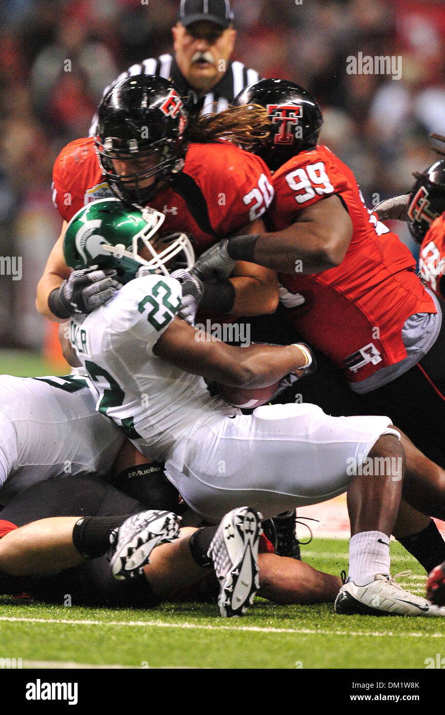 Michigan State running back Larry Caper #22 and Texas Tech linebacker ...