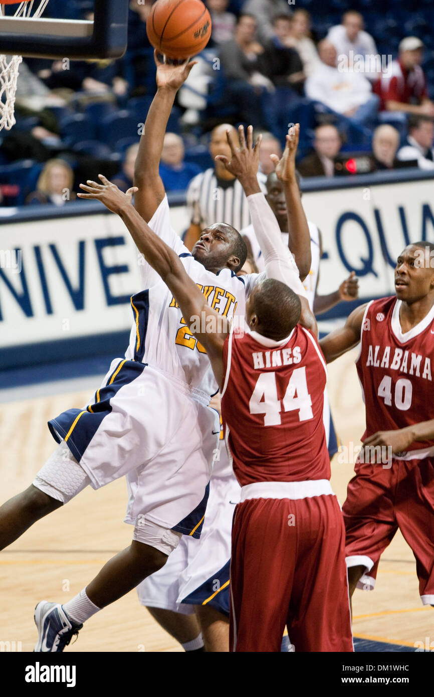 Toledo guard Malcolm Griffin (23) shoots over Alabama's Chris Hines (44 ...
