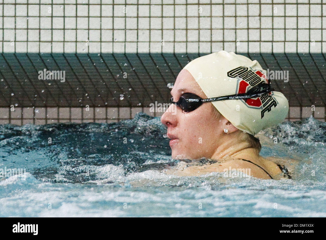 An Ohio State swimmer looks to the scoreboard to see her time during ...