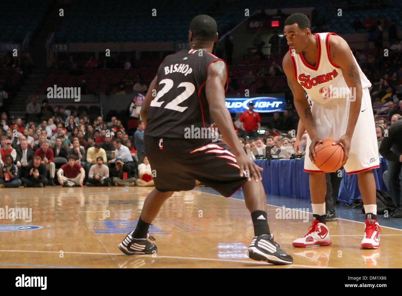 St Johns #2 Anthony Mason looks for a pass around Cincinatti's #22 ...