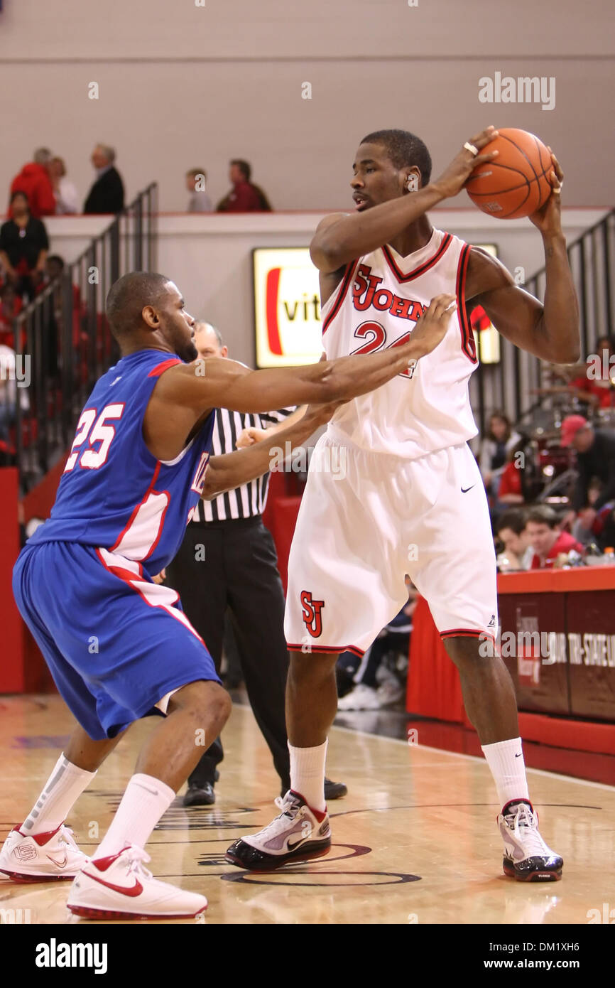 St Johns #24 Justin Burrell looks for a pass as Depaul's #25 Eric ...