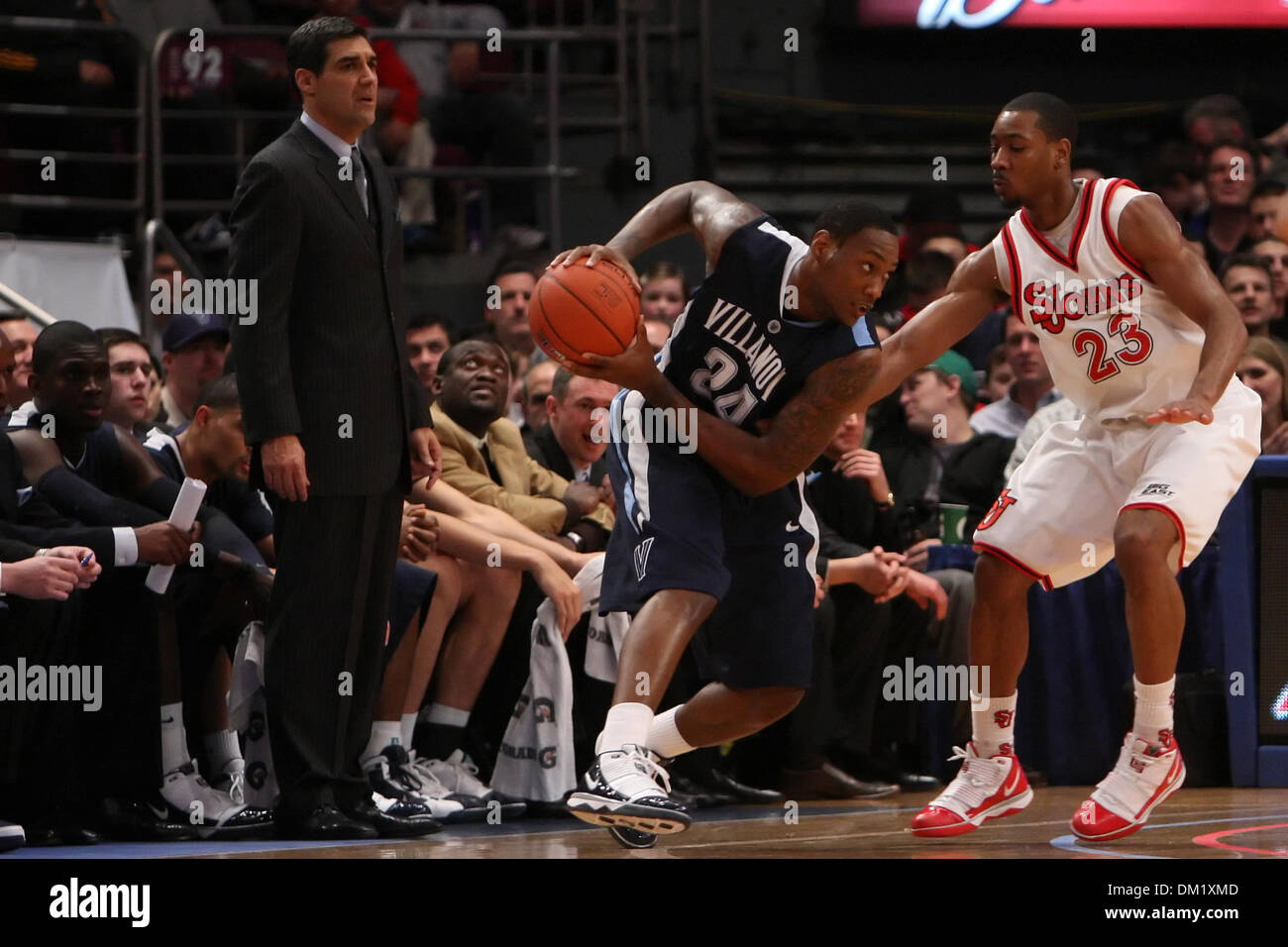 Villanova #24 Corey Stokes looks to drive past St Johns #23 Paris Horne ...