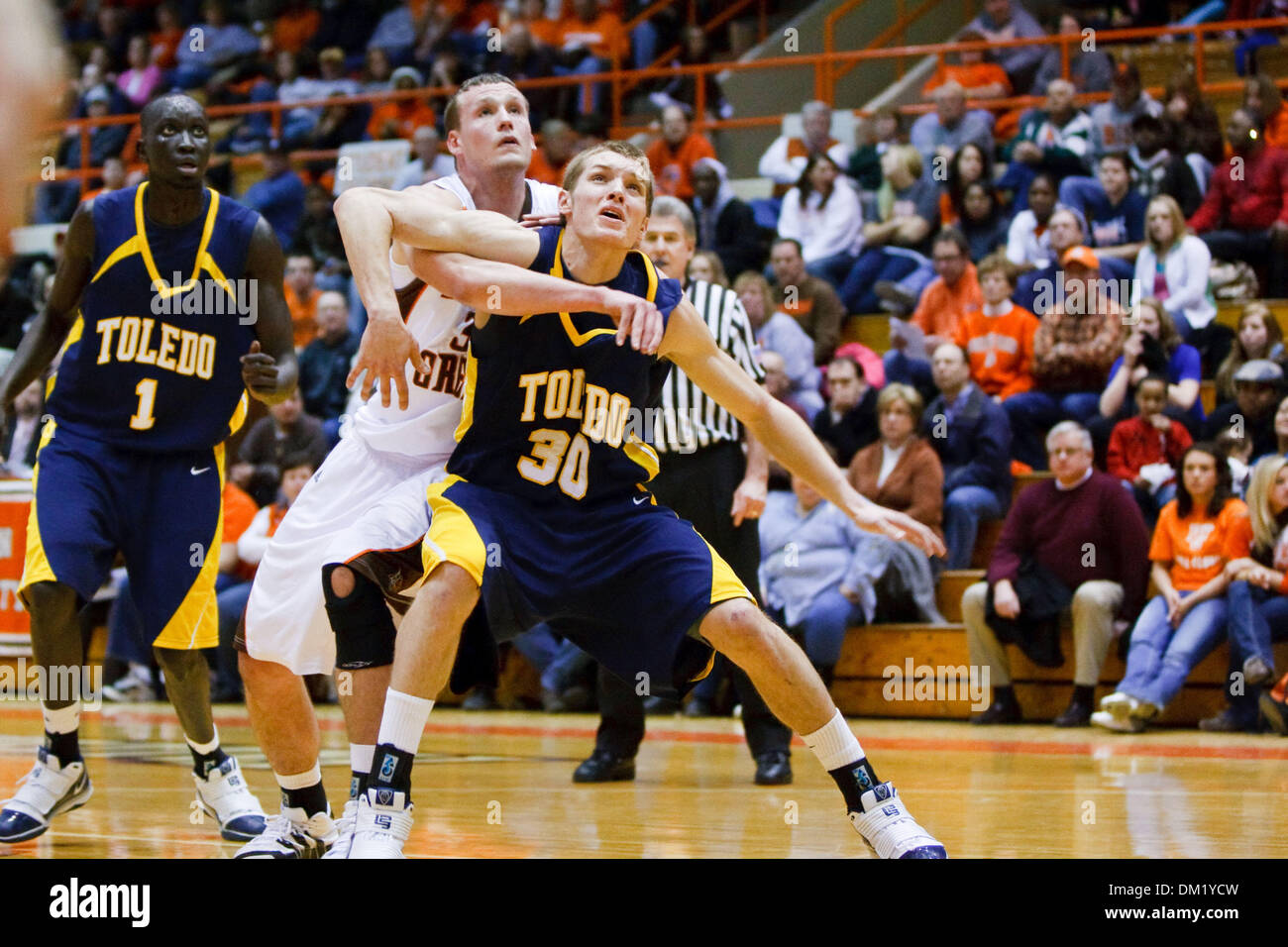 Toledo guard Jake Barnett (30) and Bowling Green forward Erik Marschall ...