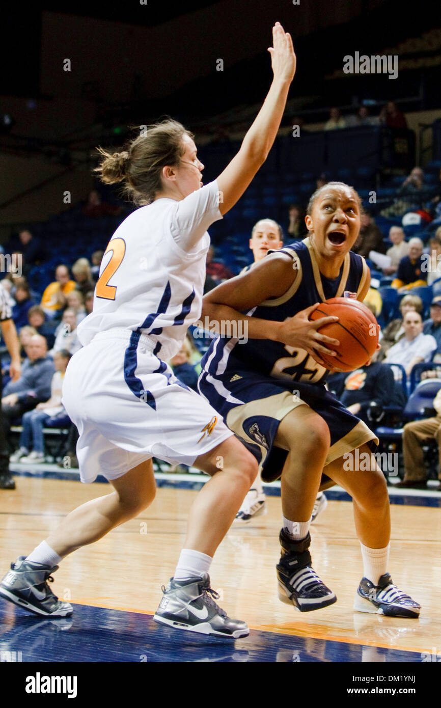 Akron forward Jolene Tamboue (25) drives into the paint for a layup ...