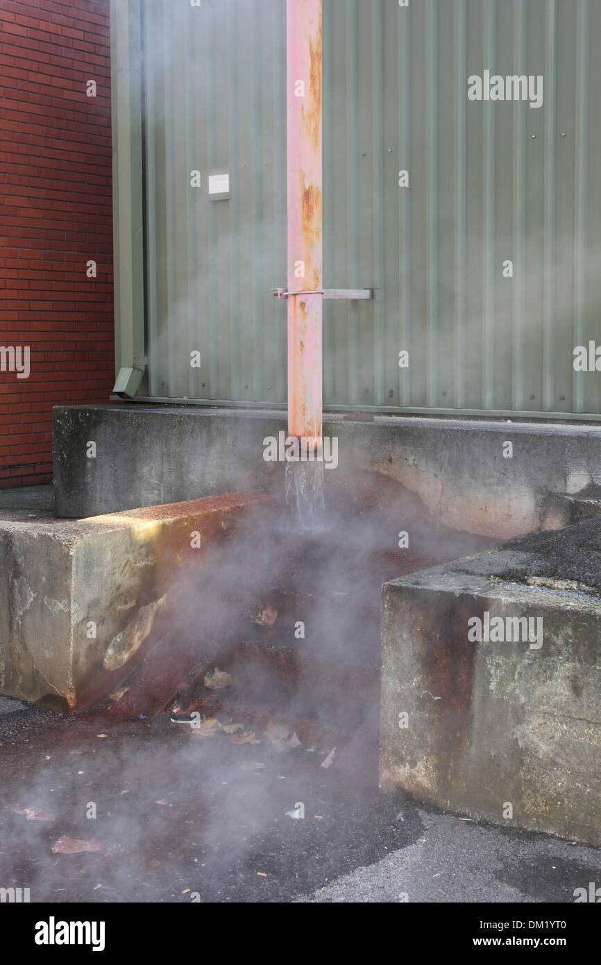 A storage tank overflowing Stock Photo - Alamy