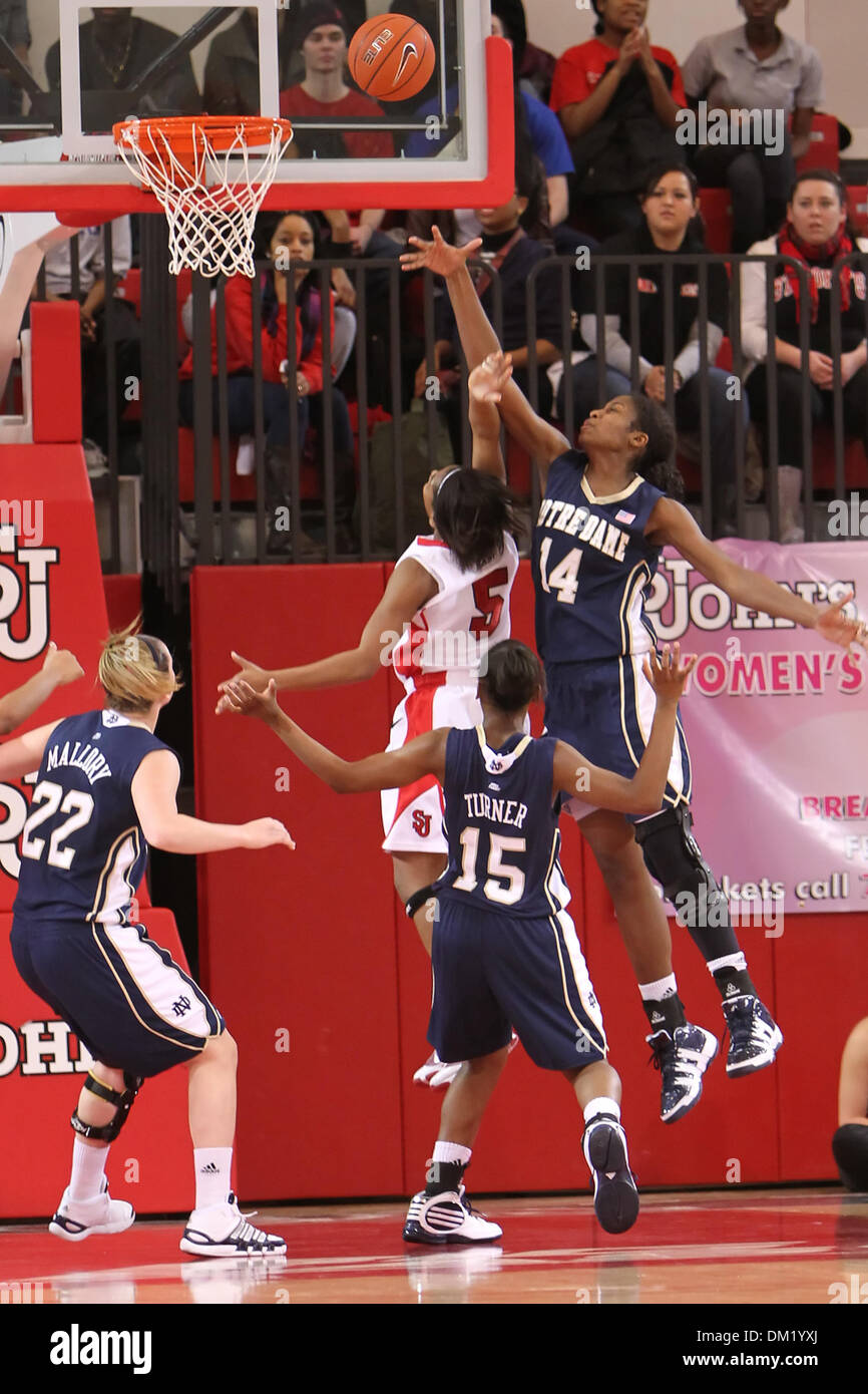 Notre Dame forward Devereaux Peters #14 shoots with St. John's guard ...