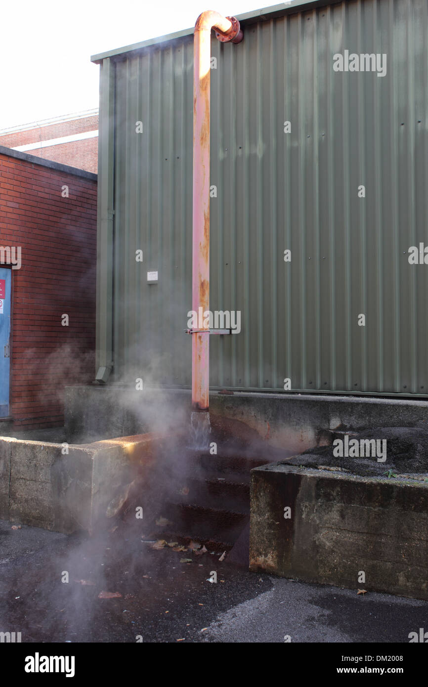 A storage tank overflowing Stock Photo - Alamy
