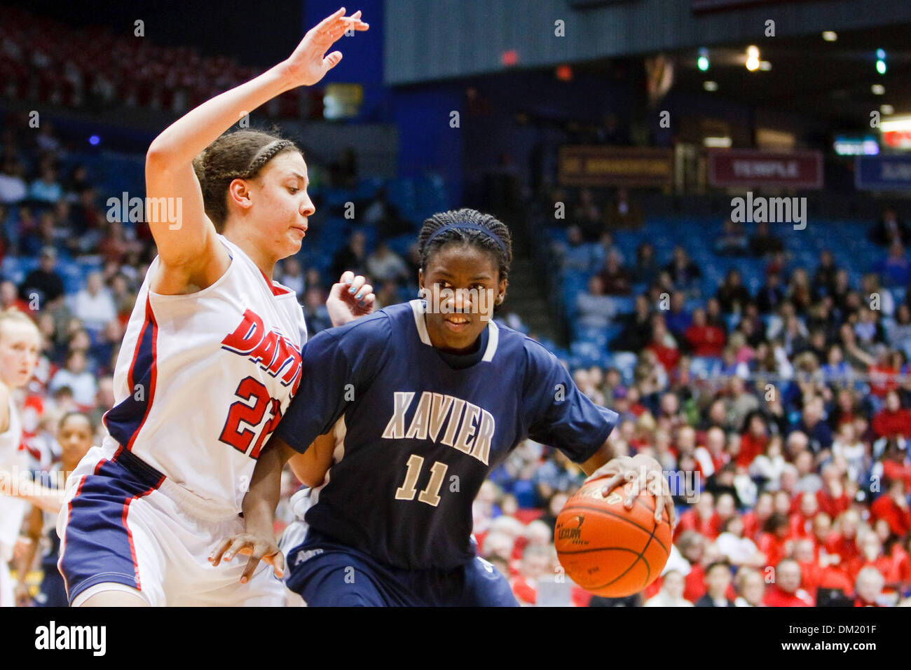 Xavier forward Amber Harris (22) tries to drive around Dayton center ...